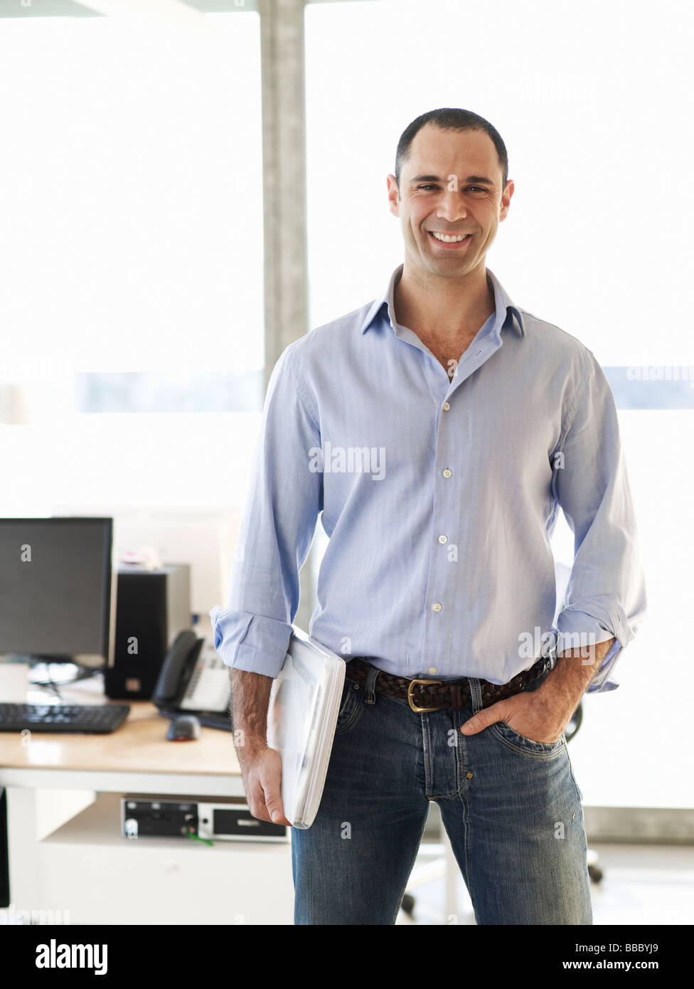 Portrait of business man in office Stock Photo - Alamy