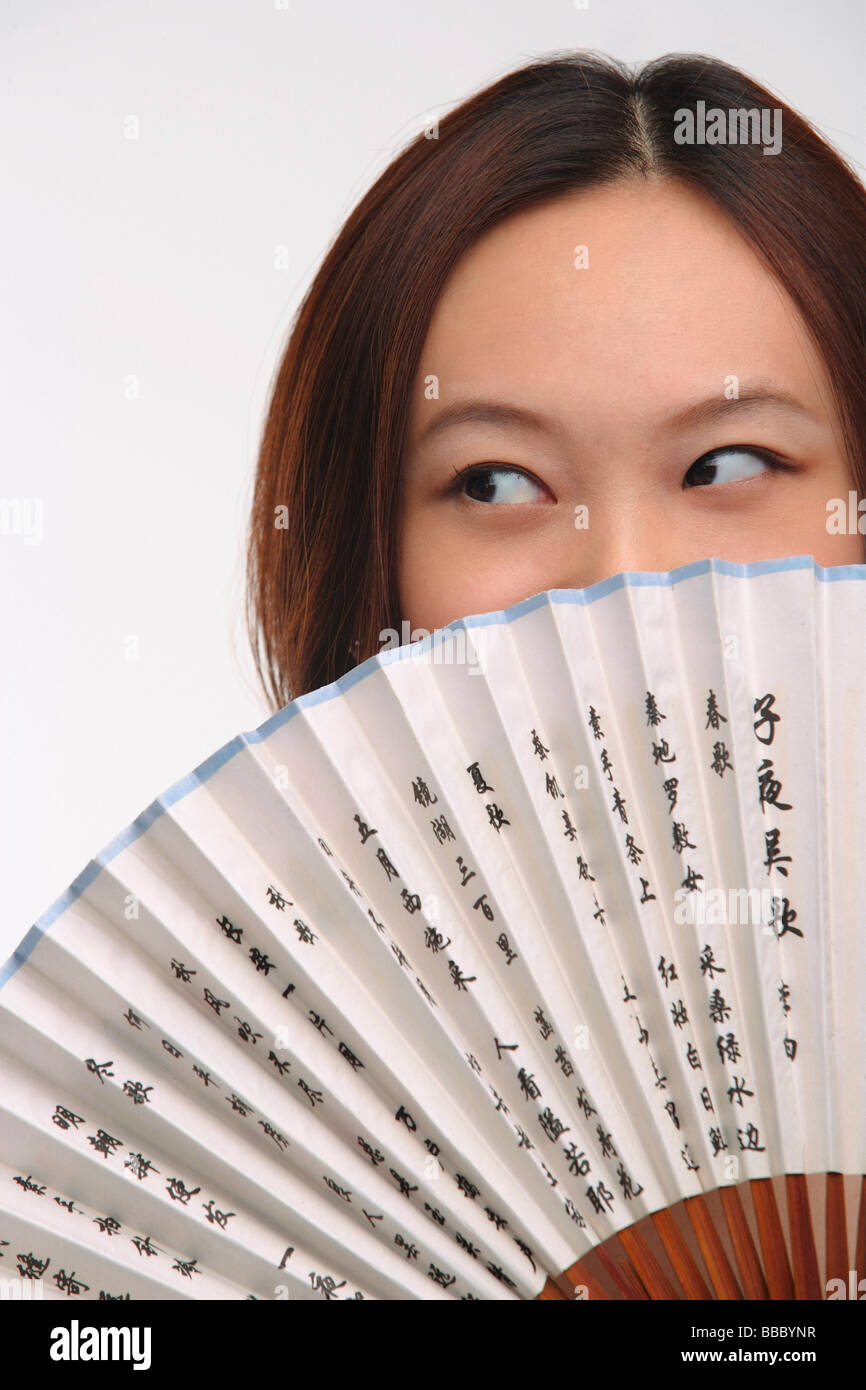 Woman standing with fan hi-res stock photography and images - Alamy