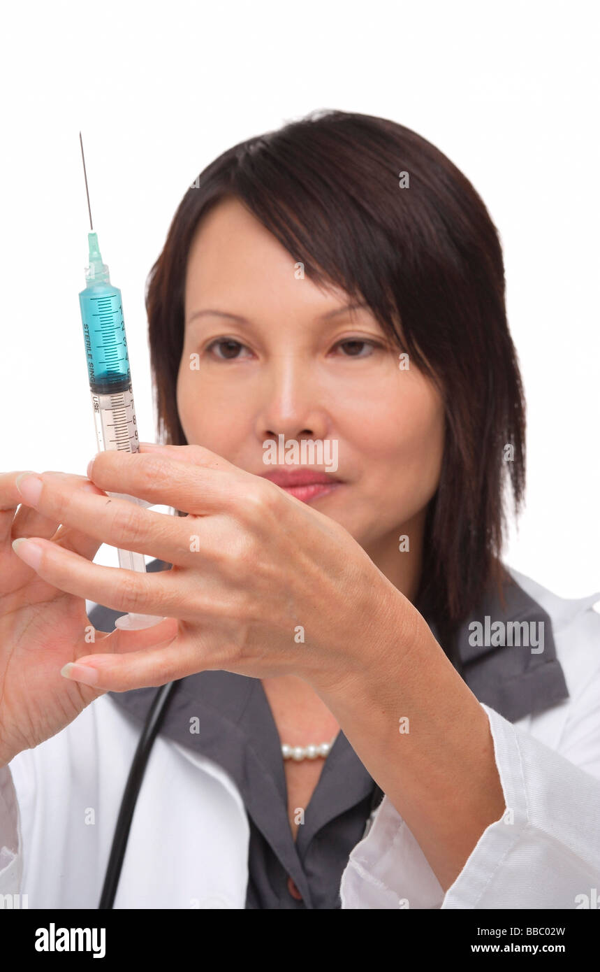 Doctor with syringe Stock Photo - Alamy