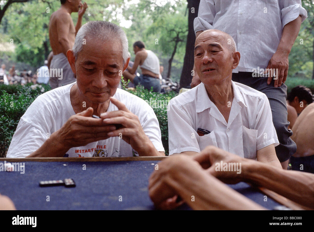China, Beijing, Old men playing traditional Chinese game Stock Photo ...