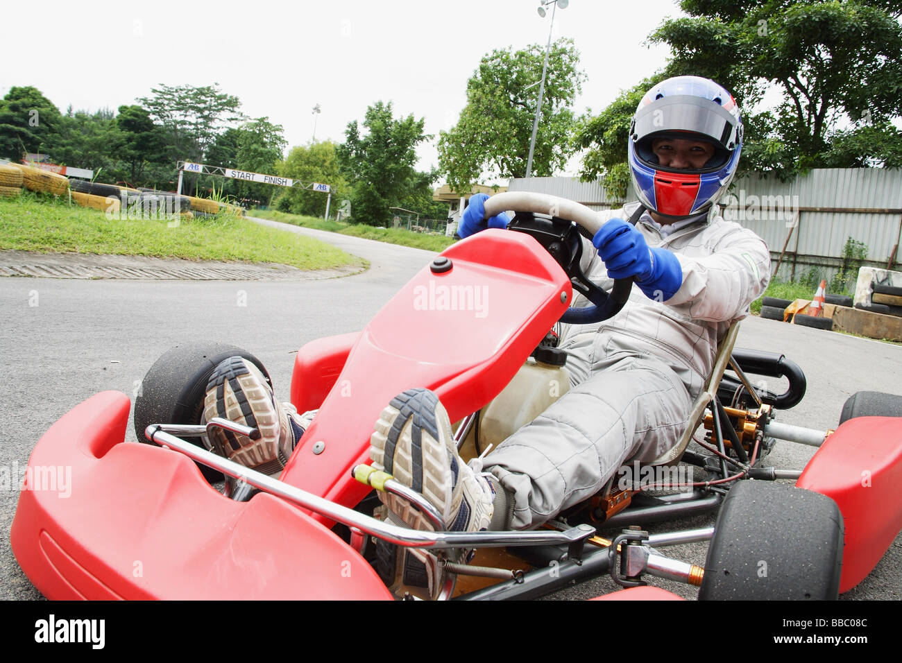 Young woman in go-cart, portrait Stock Photo - Alamy