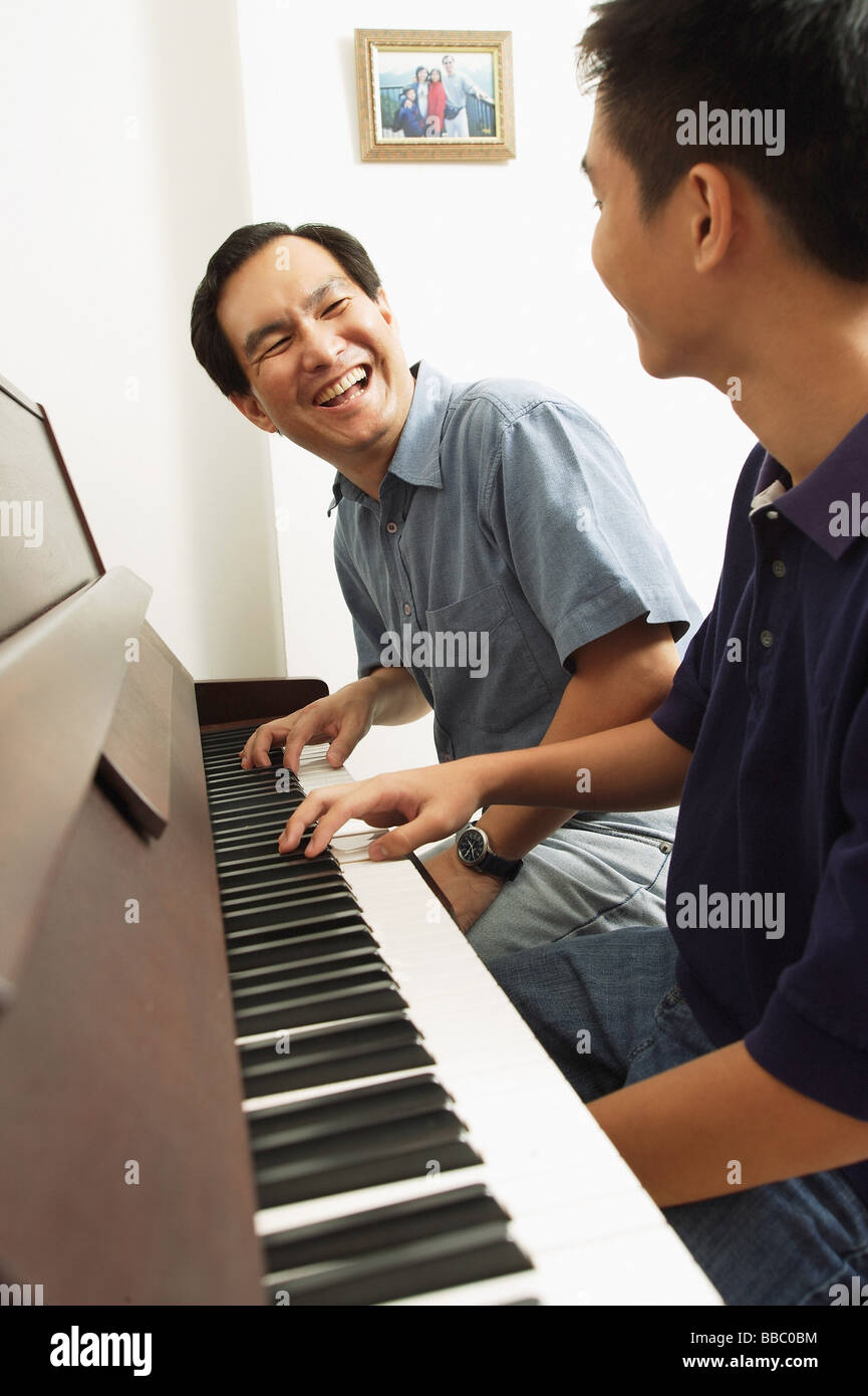 Asian man sitting piano hi-res stock photography and images - Alamy