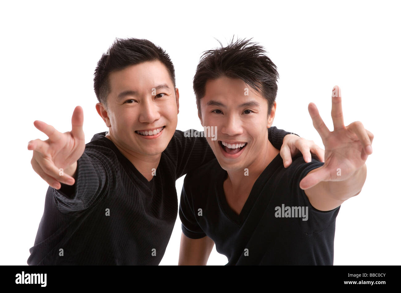 Friends smiling at camera Stock Photo - Alamy