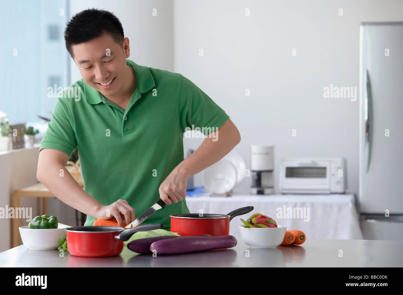 Man cooking in the kitchen Stock Photo - Alamy