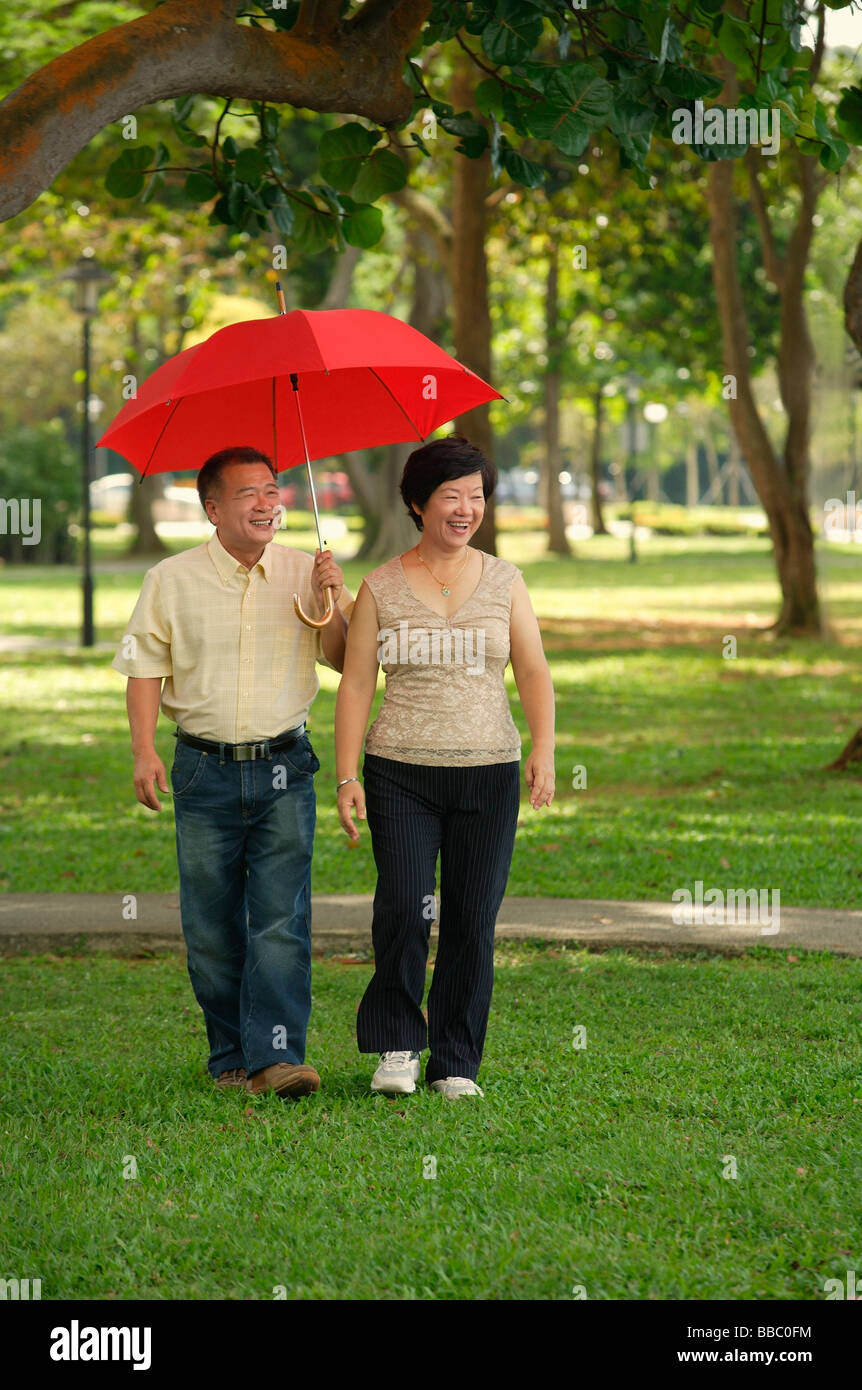 Couple taking a stroll in the park Stock Photo - Alamy