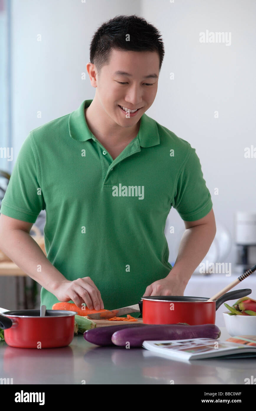 Man cooking in the kitchen Stock Photo - Alamy