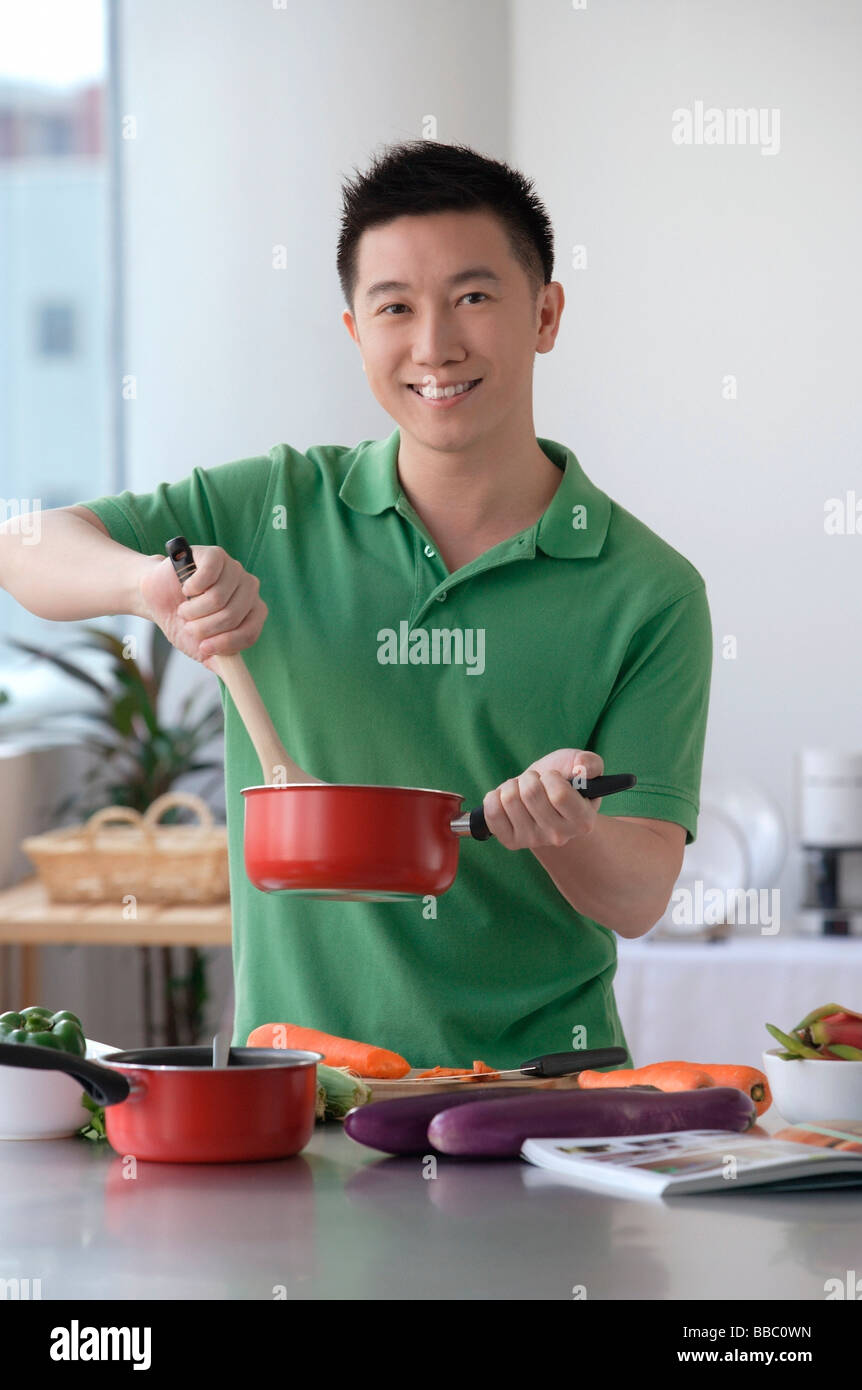 Man cooking in the kitchen Stock Photo - Alamy