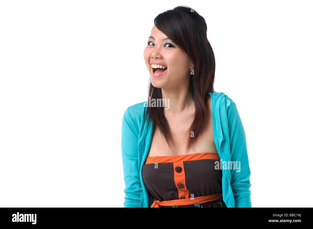 Young woman smiling at camera Stock Photo - Alamy
