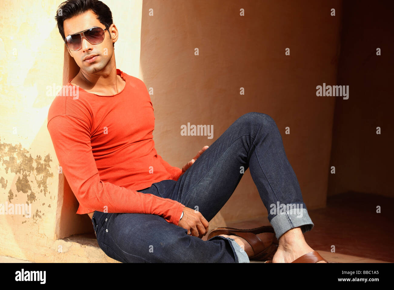 man reclining in sunshine Stock Photo - Alamy