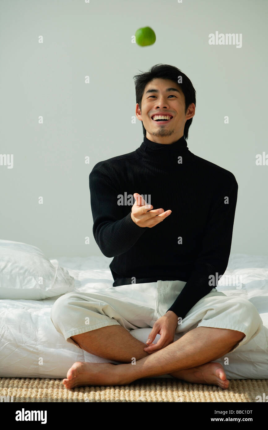 Throwing apple into air hi-res stock photography and images - Alamy