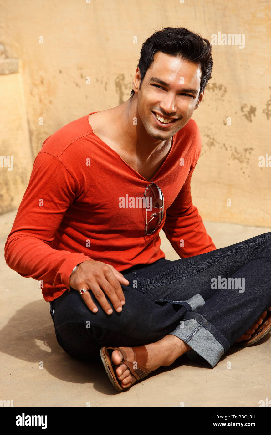 man sitting in sunshine Stock Photo - Alamy