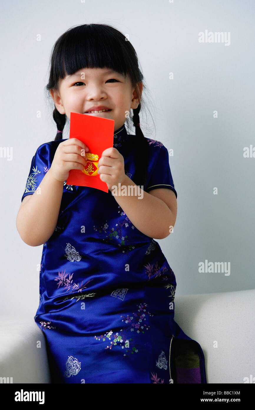 Asian Girl Holding Red Packet High Resolution Stock Photography and ...