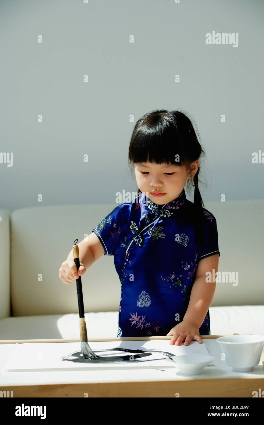Chinese girl writing calligraphy hi-res stock photography and images ...