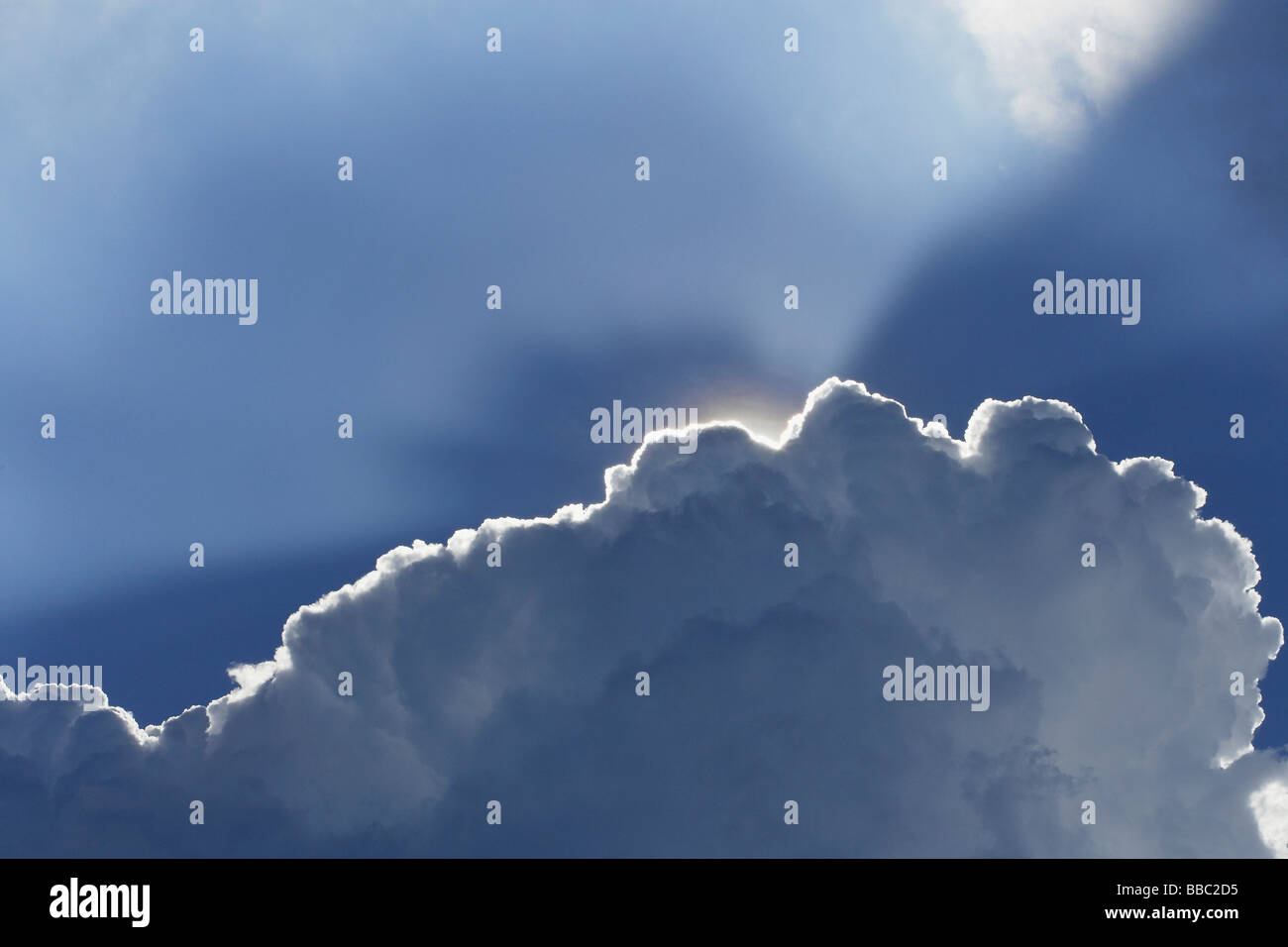 The sun shining from behind clouds Stock Photo - Alamy
