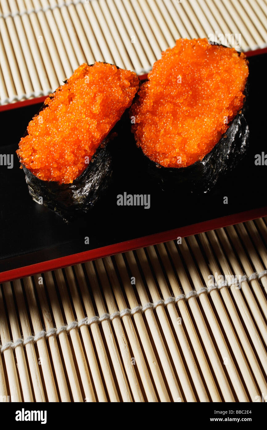 2 pieces of sushi, Tobiko Gunkan, fish roe Stock Photo - Alamy
