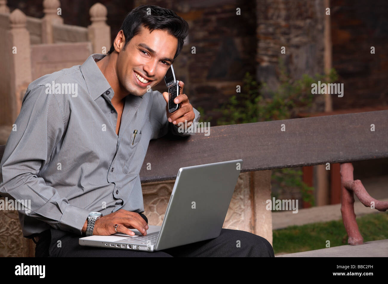 man on phone, with laptop computer Stock Photo - Alamy