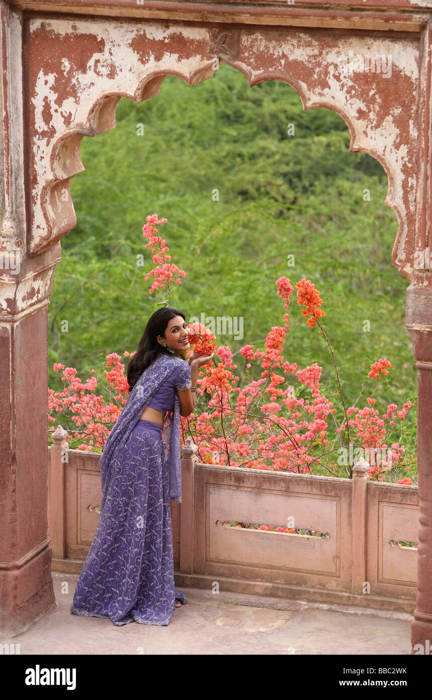 young woman at balcony, smiling Stock Photo - Alamy