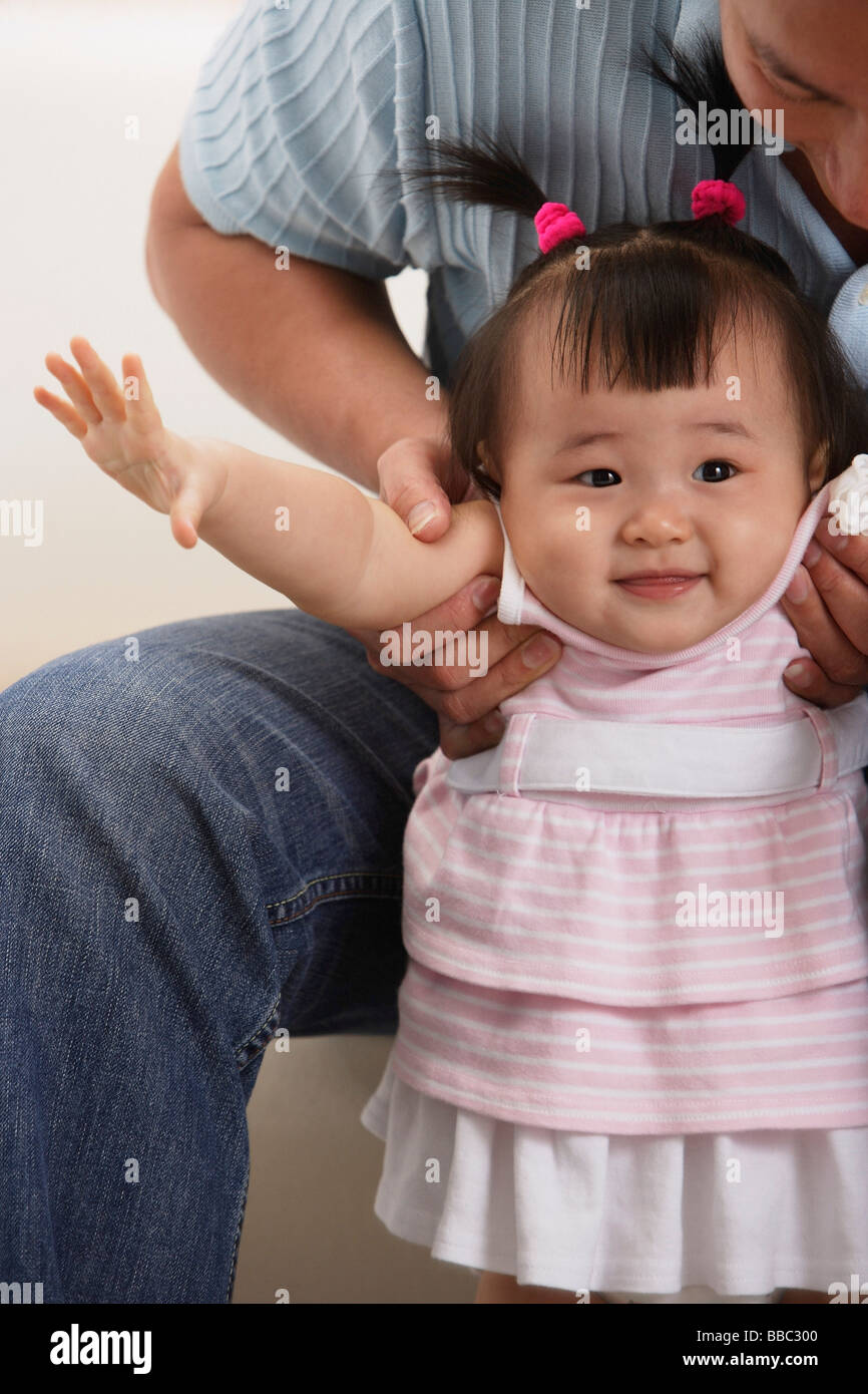 father and baby girl, father holding girl under arms Stock Photo - Alamy
