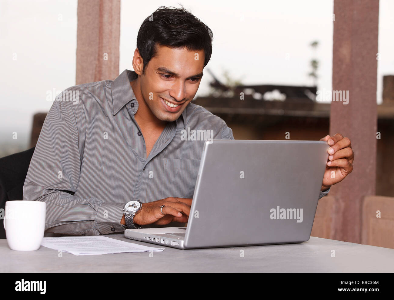 man working at laptop computer Stock Photo - Alamy