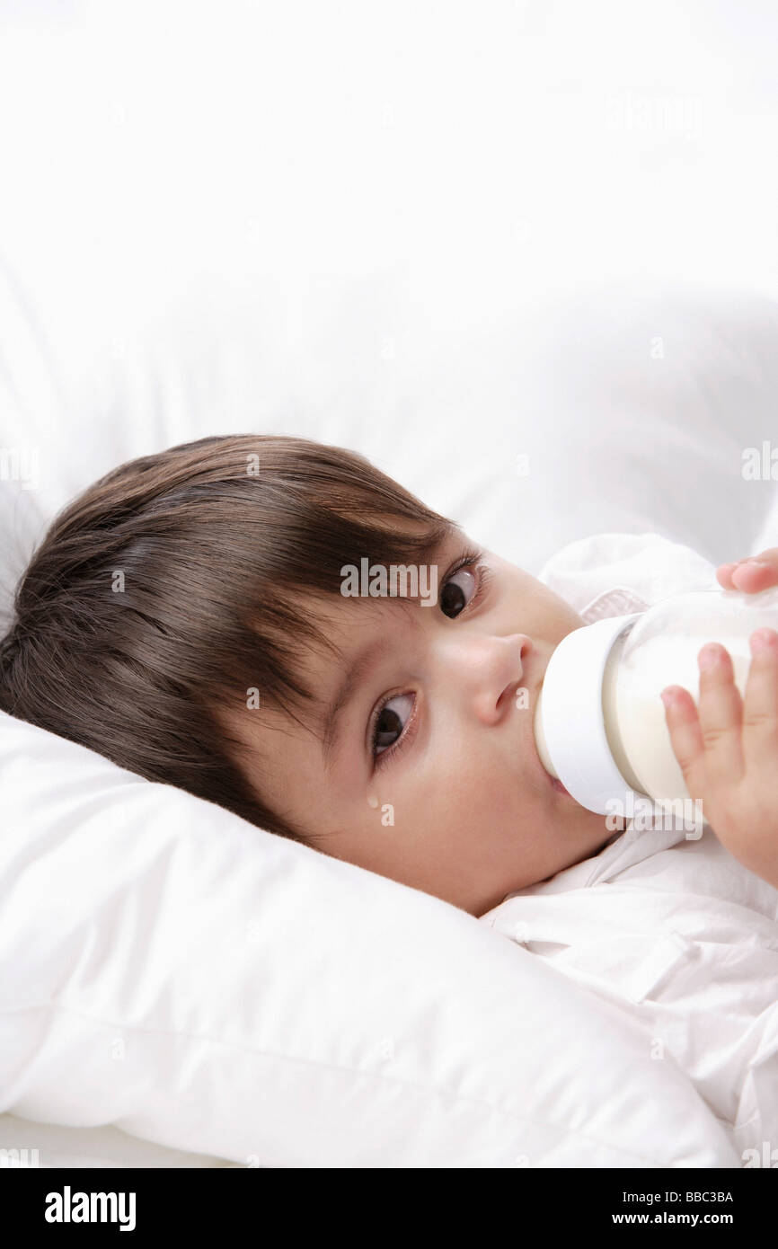 baby boy drinking from bottle Stock Photo - Alamy