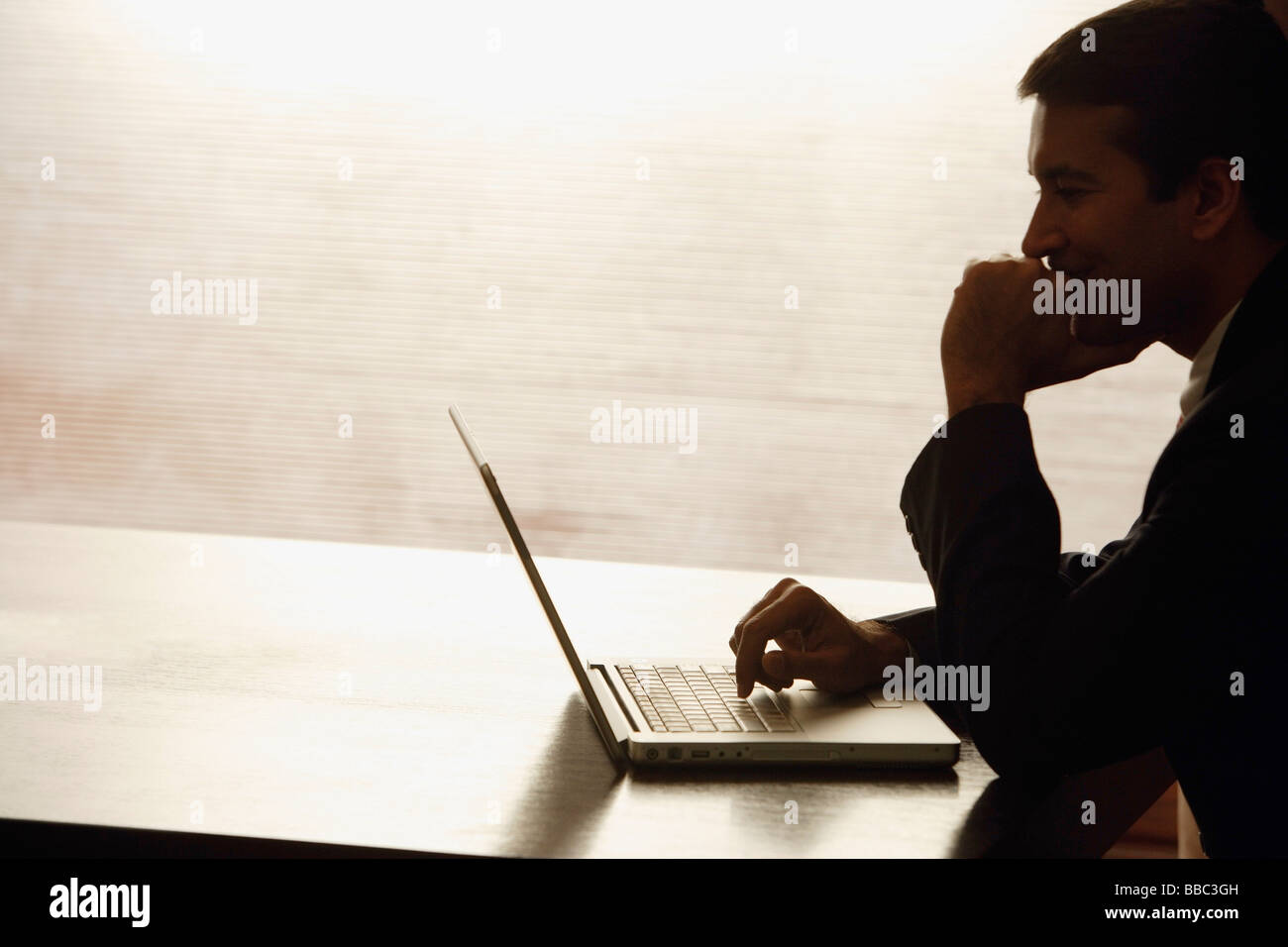 businessman working on laptop computer Stock Photo - Alamy