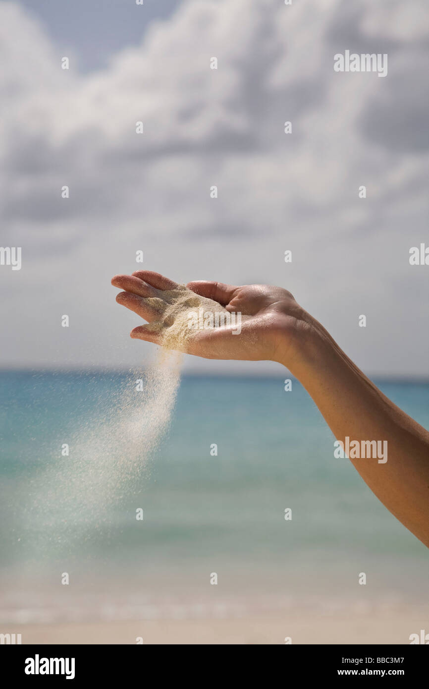 Sand Falling from Woman's Hand Stock Photo - Alamy