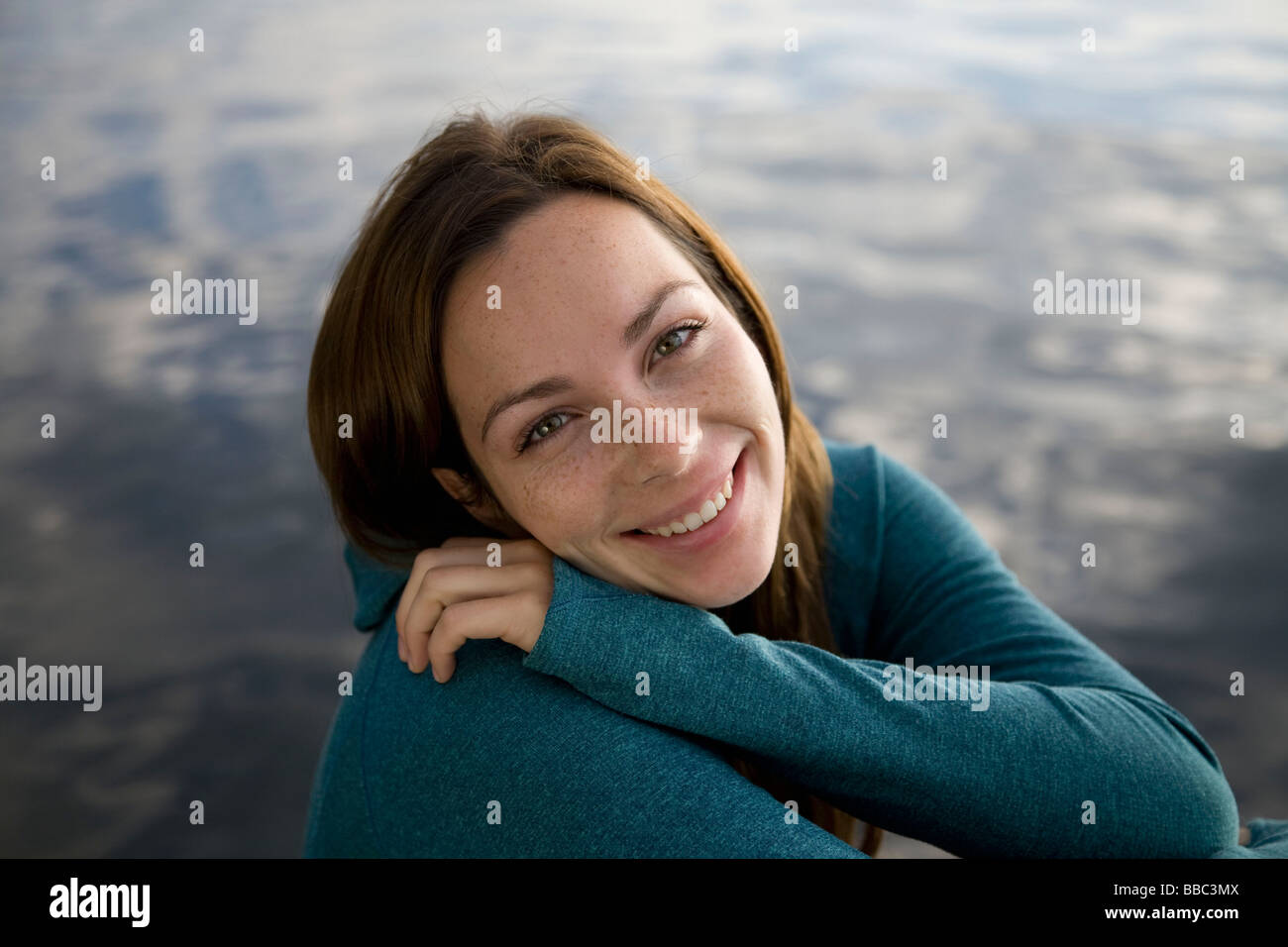 Woman Smiling into Camera Stock Photo - Alamy