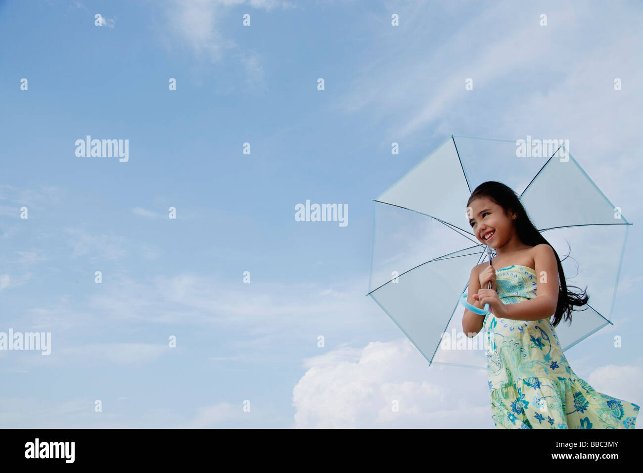 Holding umbrella up over her head hi-res stock photography and images ...
