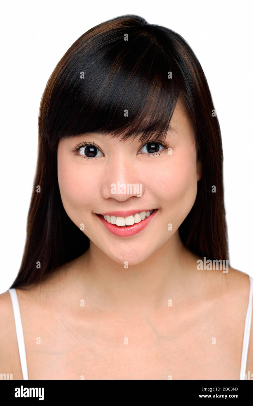 Young woman smiling at camera, portrait Stock Photo - Alamy