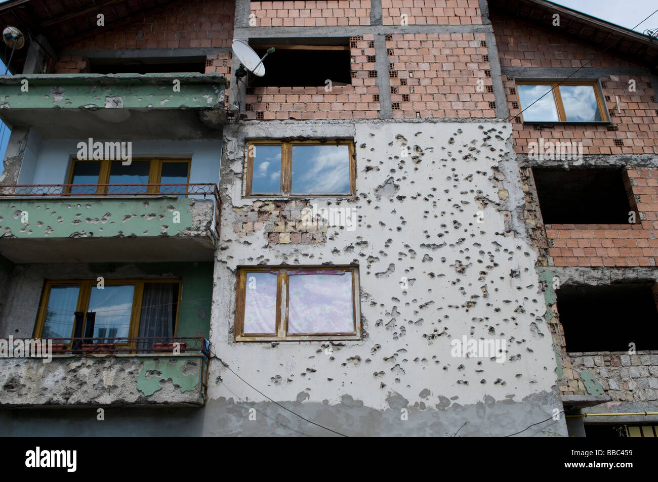 Exterior of a house shows shrapnel damage from the 1992-95 war in ...