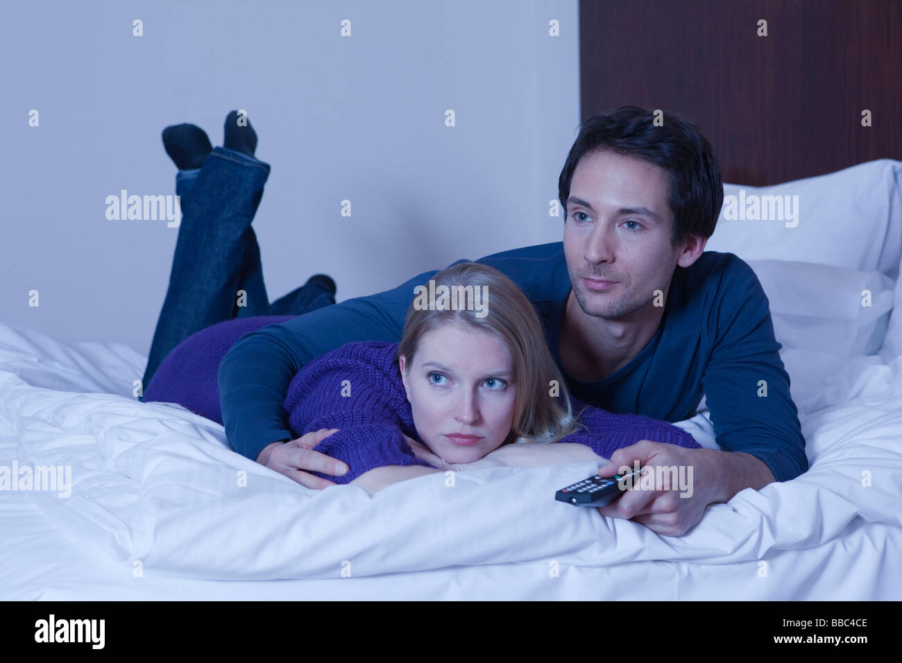 Couple watching tv serious hi-res stock photography and images - Alamy