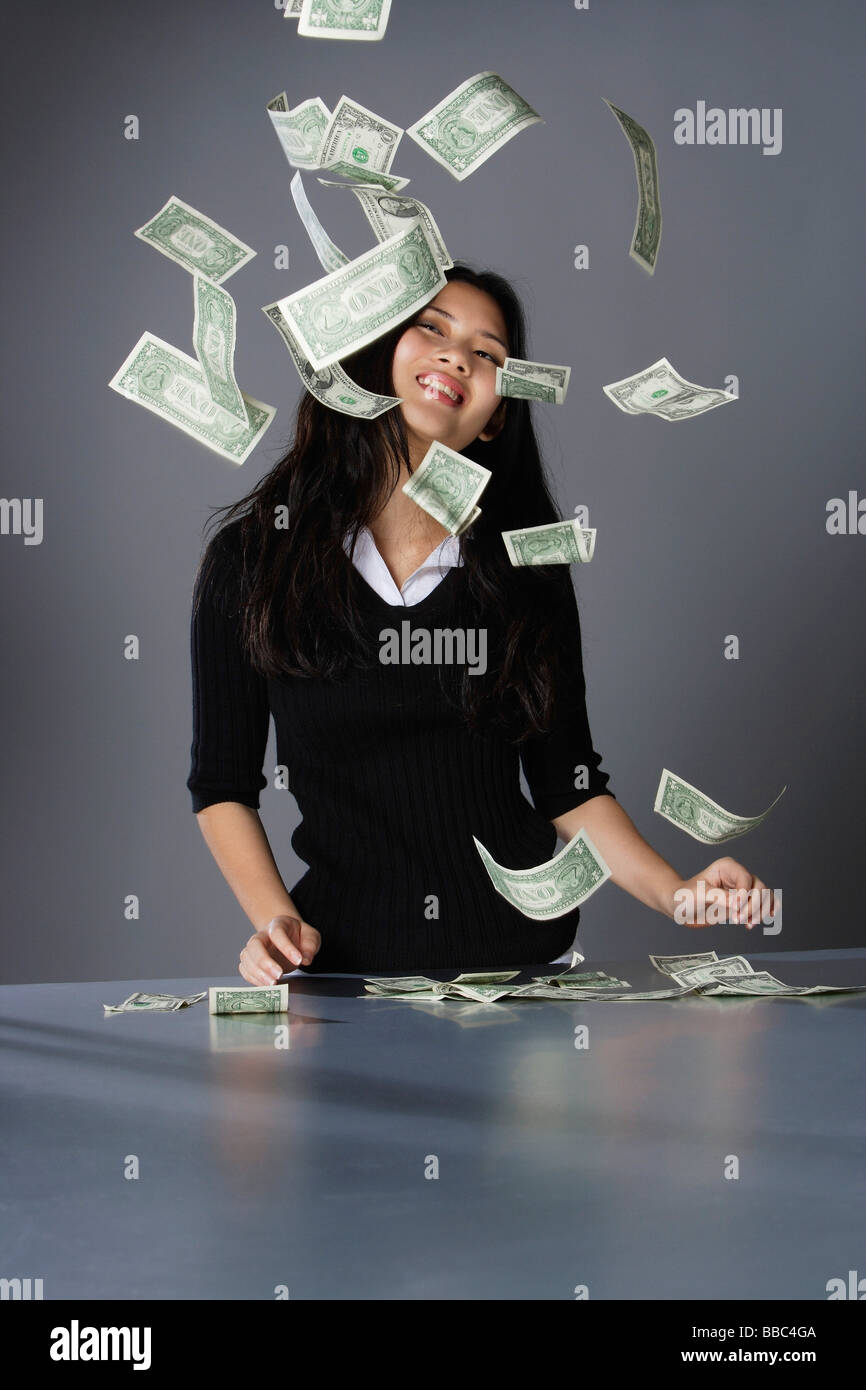 Money falling hi-res stock photography and images - Alamy
