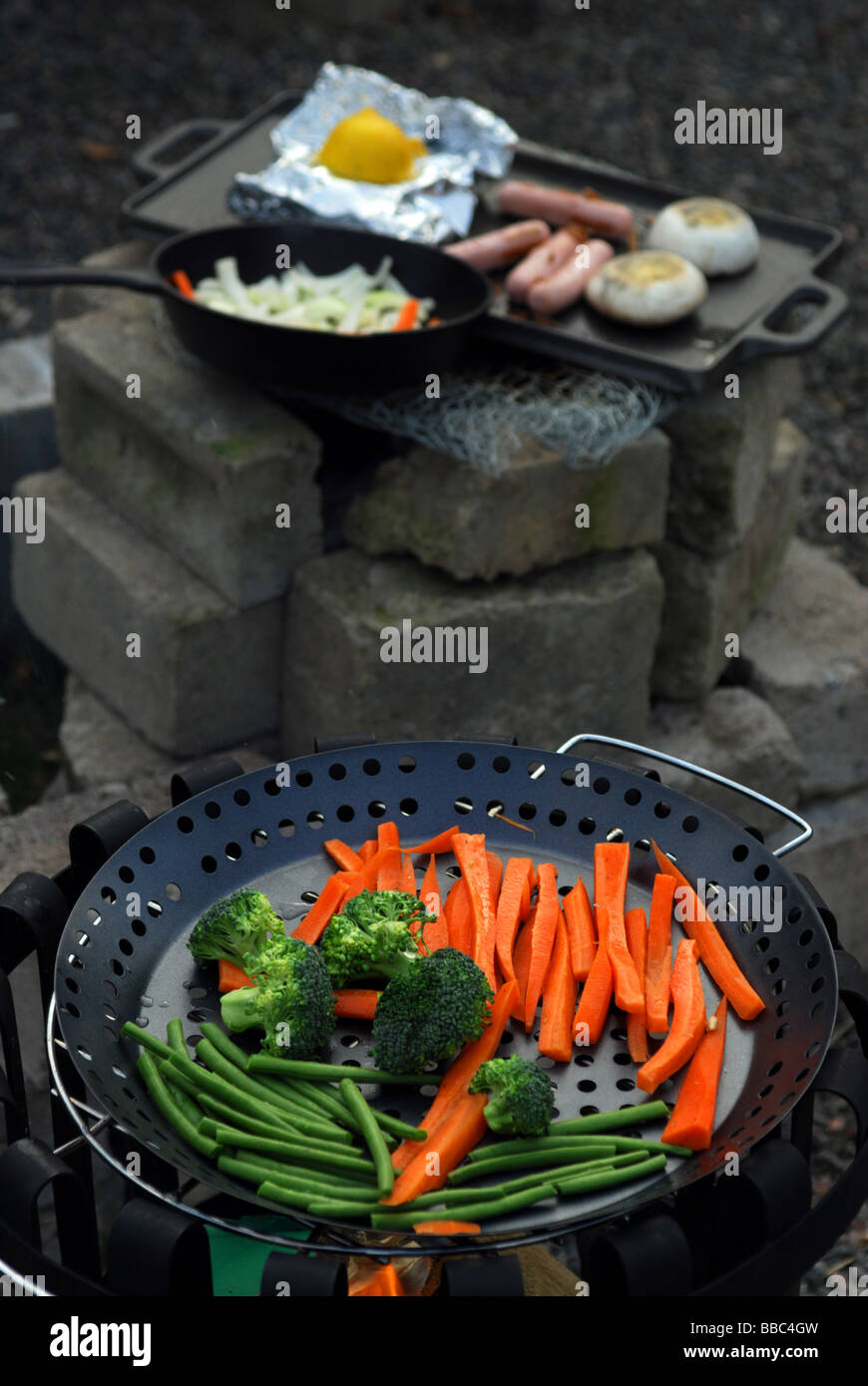 Outdoor wood fire used to cook food Stock Photo - Alamy