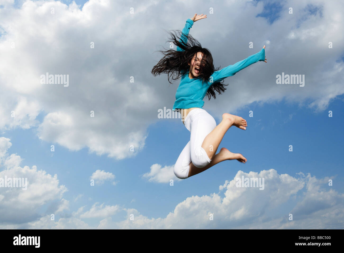 young lady jumping in midair Stock Photo - Alamy