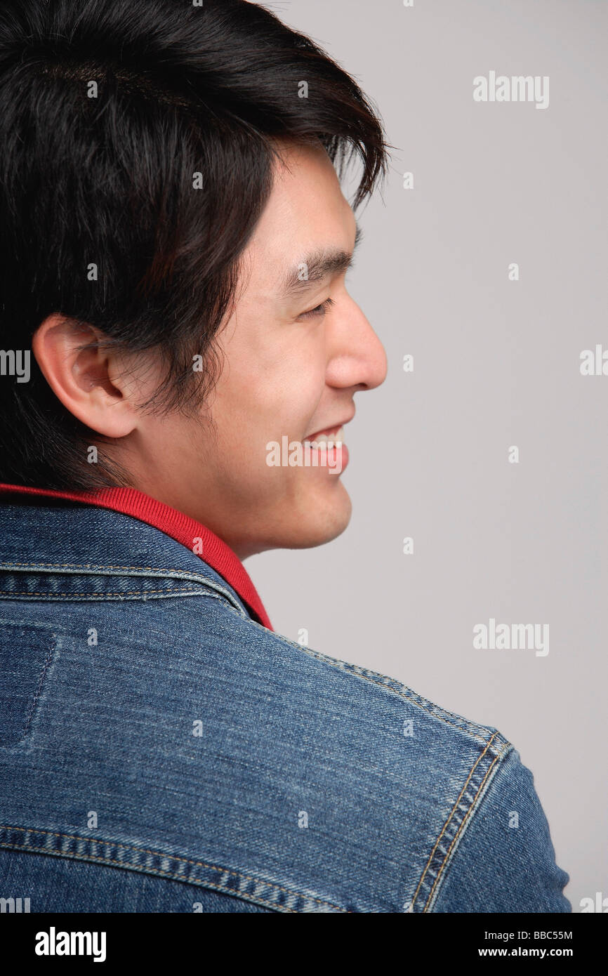 Man smiling, over the shoulder view Stock Photo - Alamy