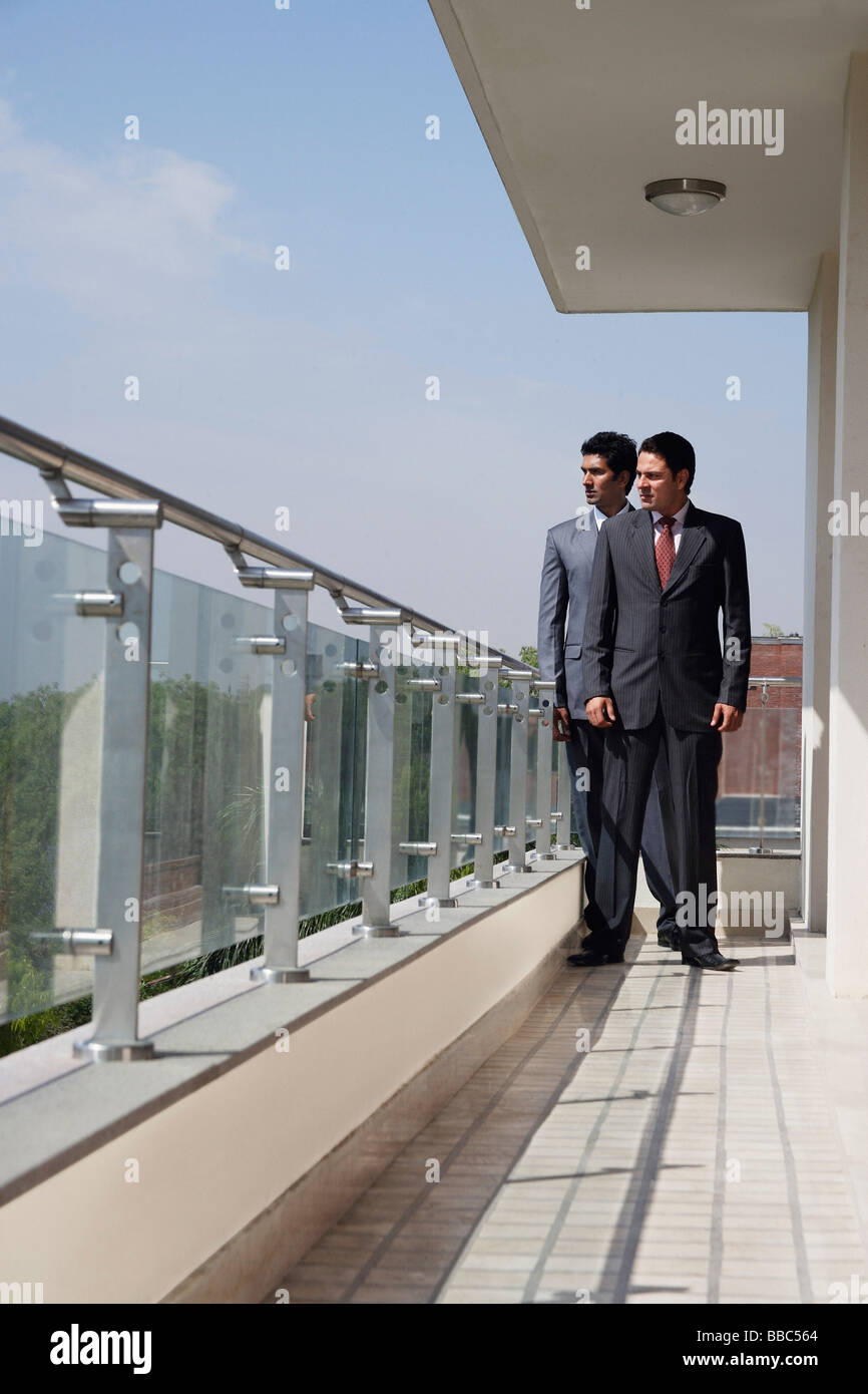 businessmen on balcony Stock Photo - Alamy