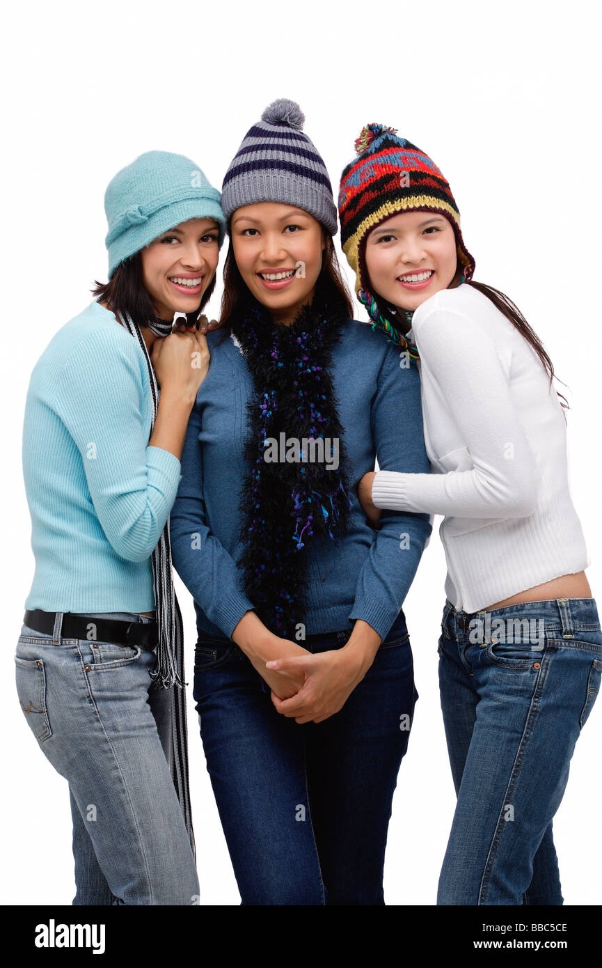 Three young women wearing scarves and hats, winter Stock Photo - Alamy