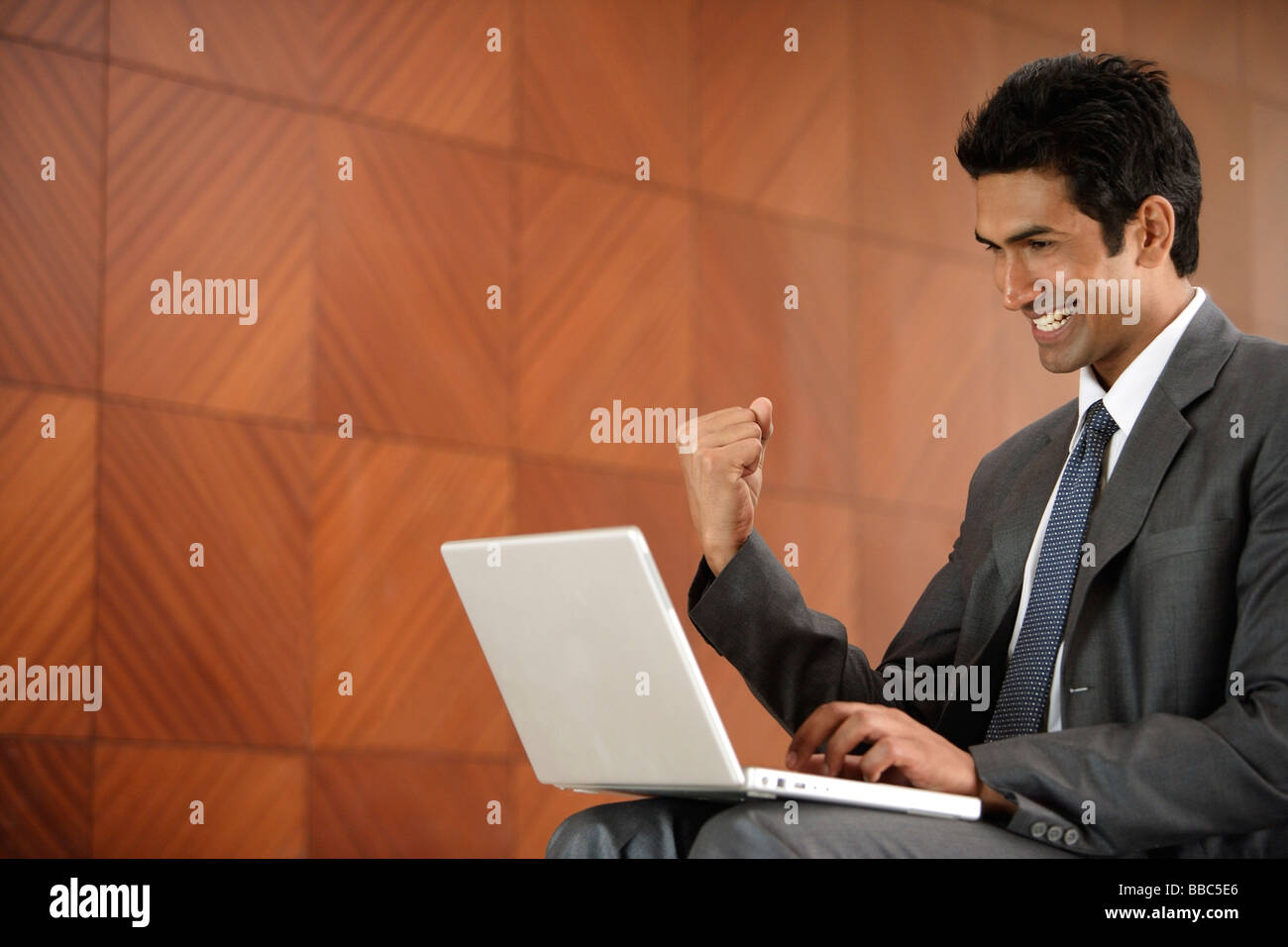 happy businessman on computer Stock Photo - Alamy