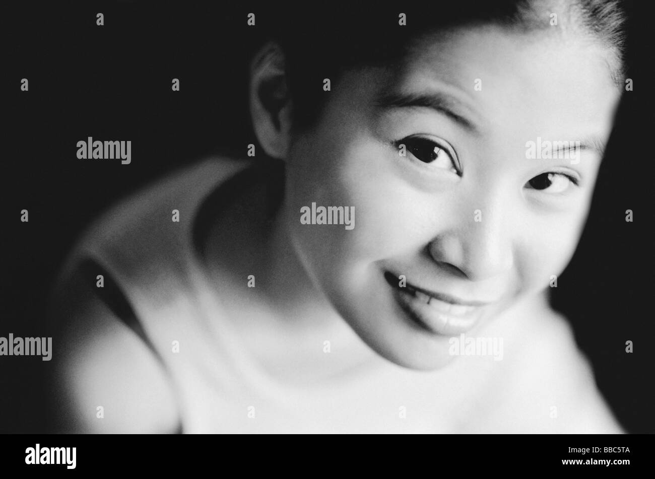 Young woman looking up, smiling, elevated view Stock Photo - Alamy