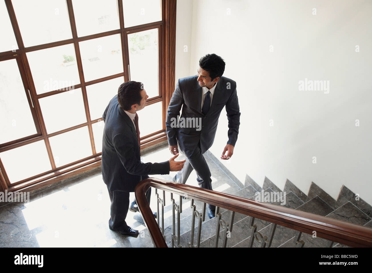 businessmen walking up the stairs Stock Photo - Alamy