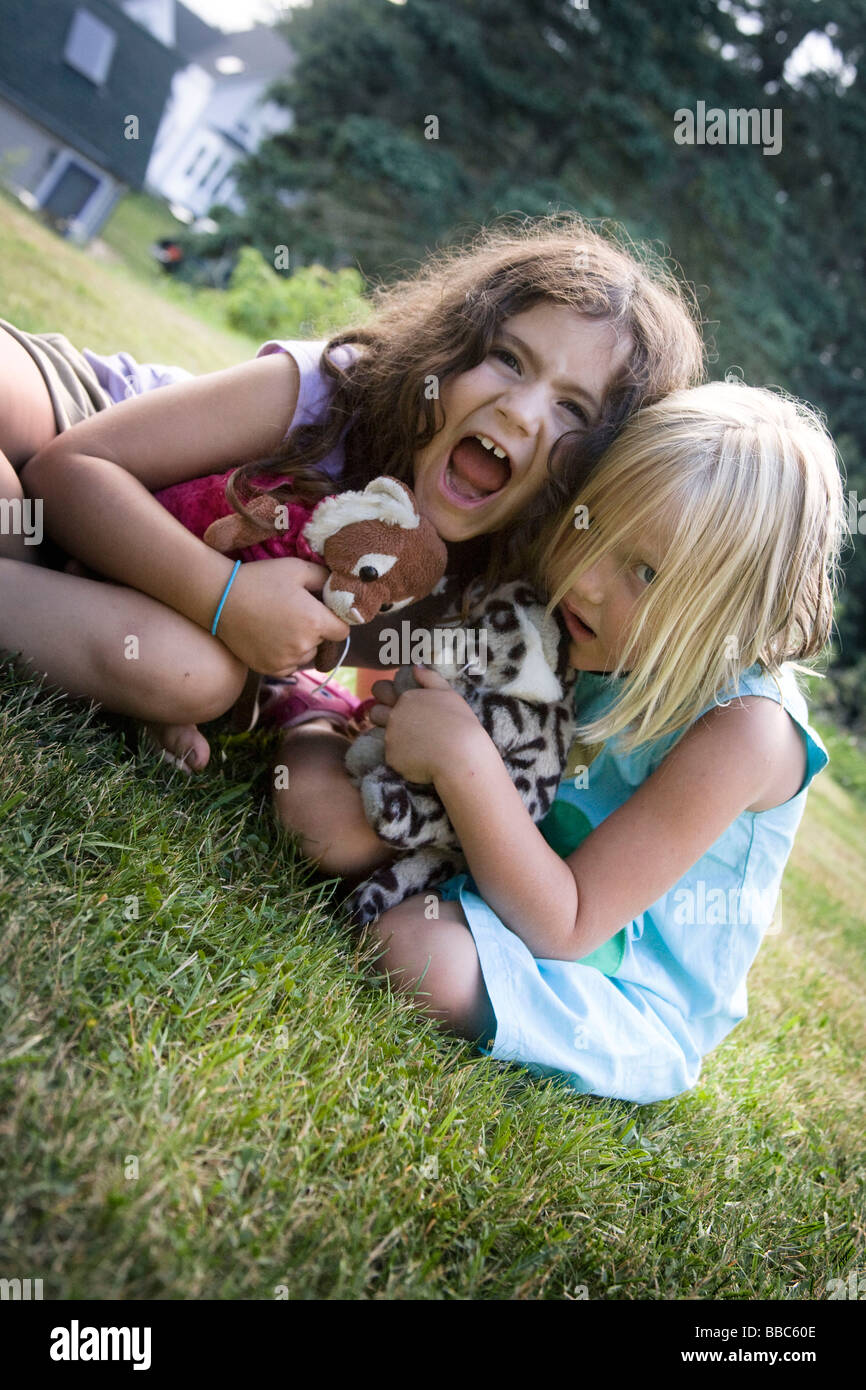 Girls playing in backyard Stock Photo - Alamy