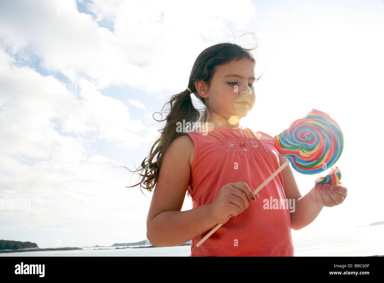 Little girl with huge lolly pop Stock Photo - Alamy