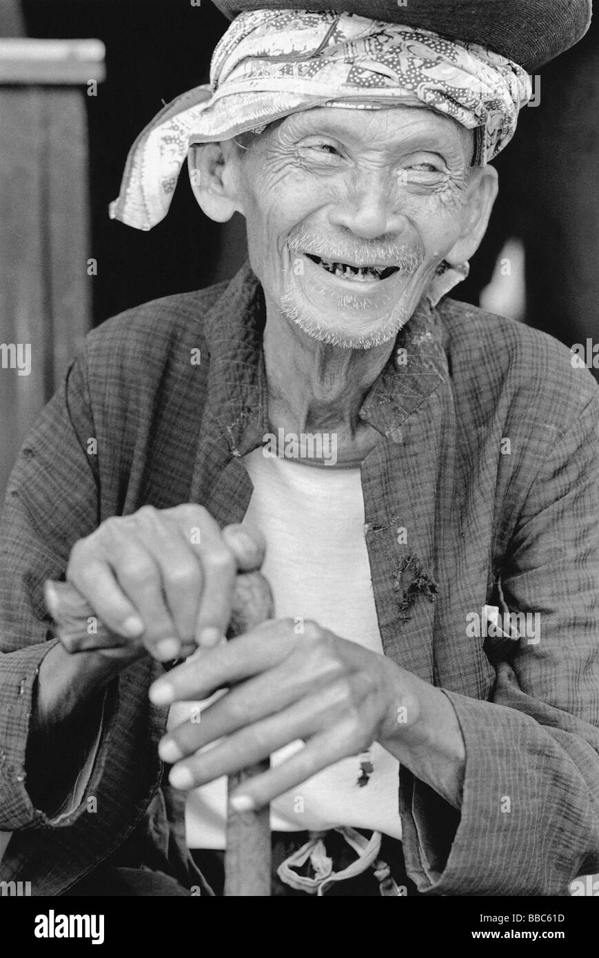 Elderly man holding walking stick Black and White Stock Photos & Images ...