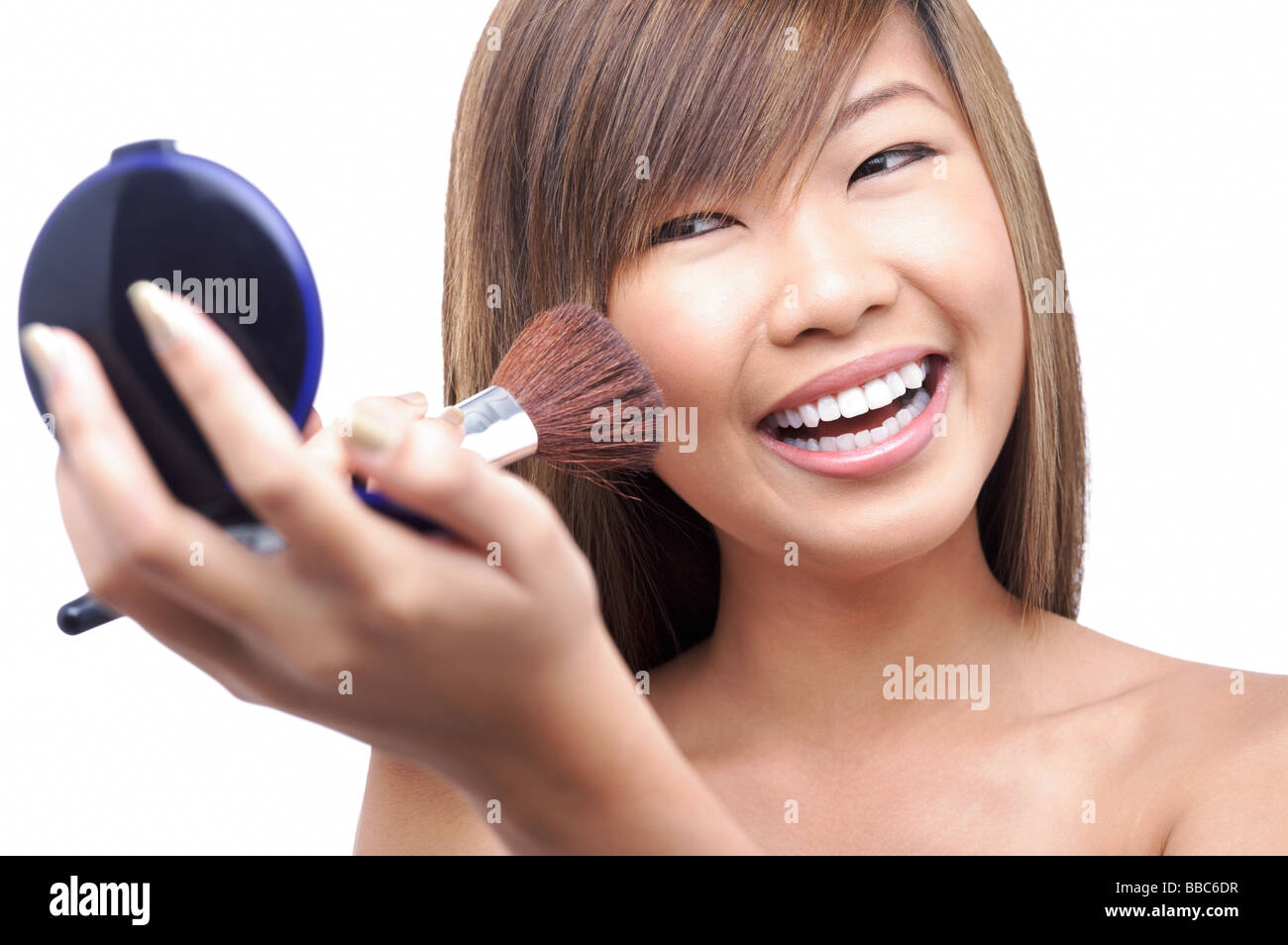 Teenage girl applying make-up Stock Photo - Alamy