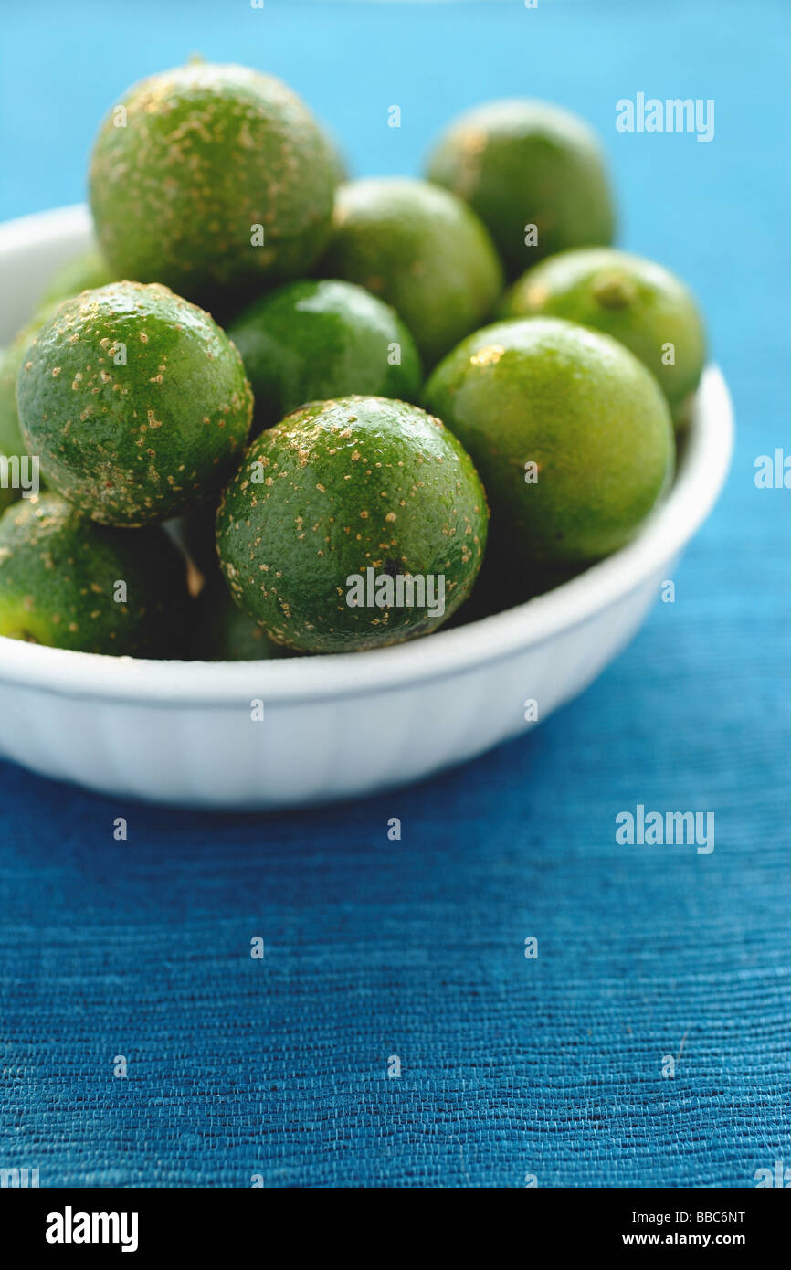 Still life of bowl of limes Stock Photo - Alamy