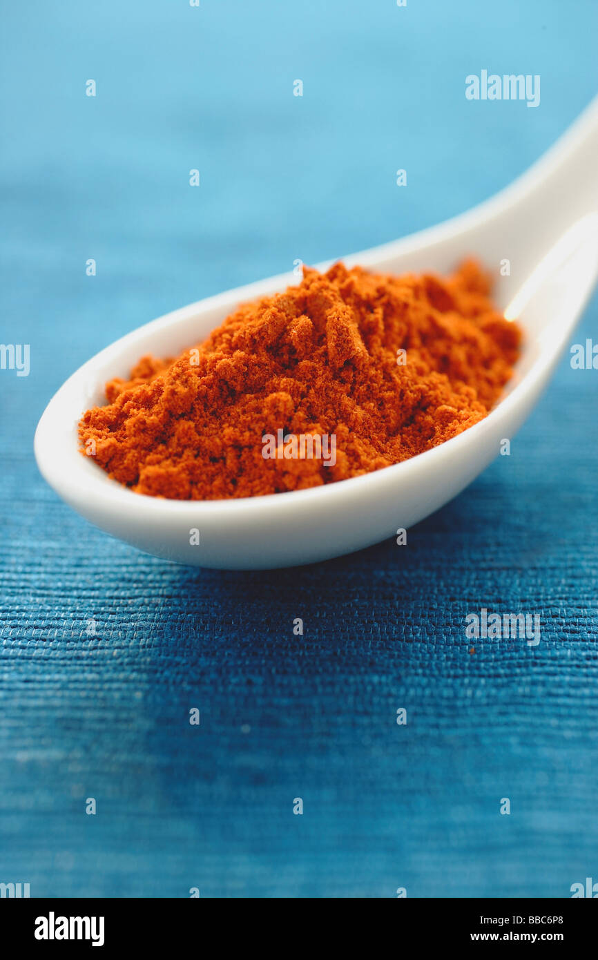 Still life of spoon with chili powder Stock Photo - Alamy
