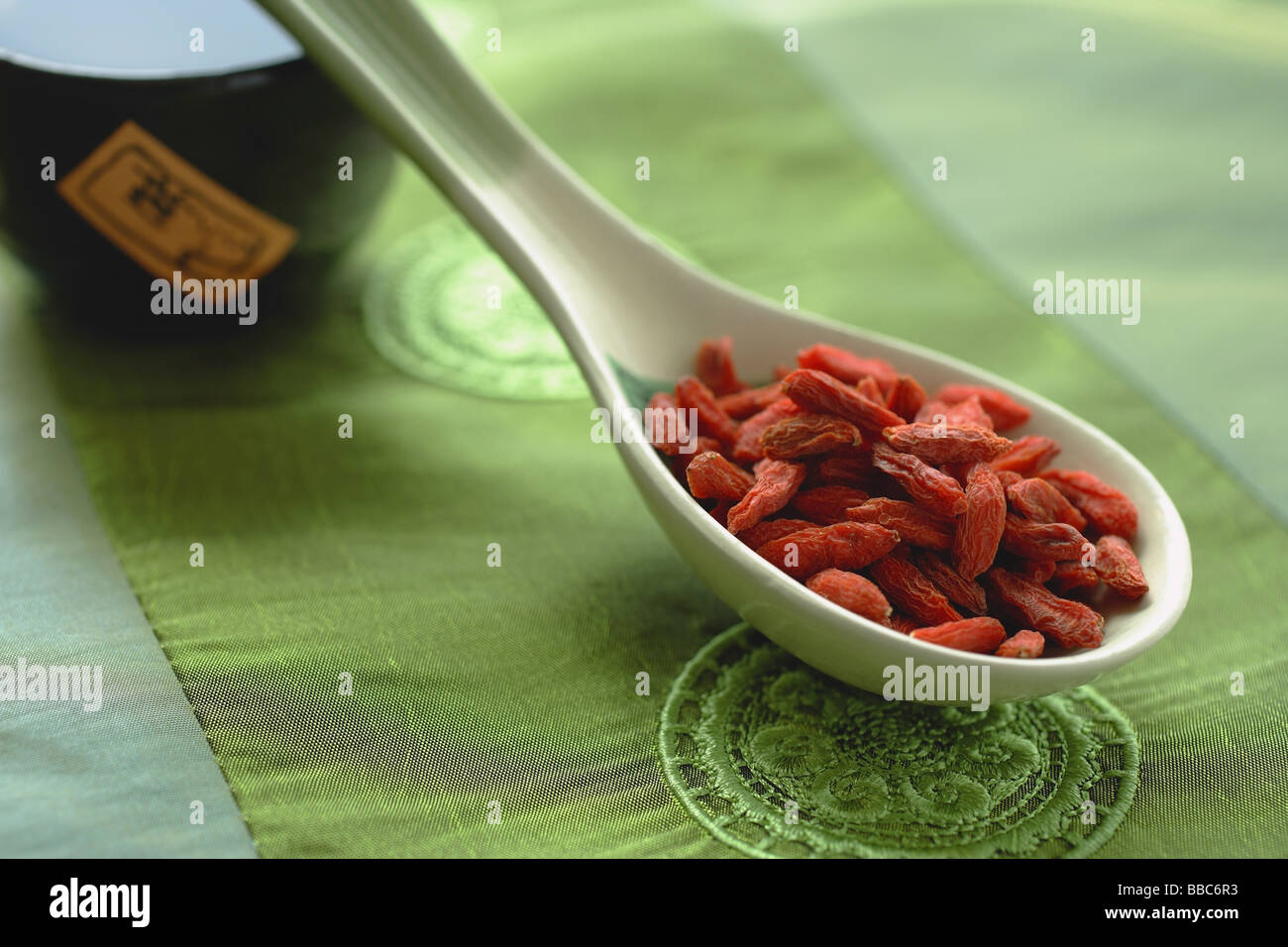 Dried fruit in ceramic spoon, still life Stock Photo - Alamy