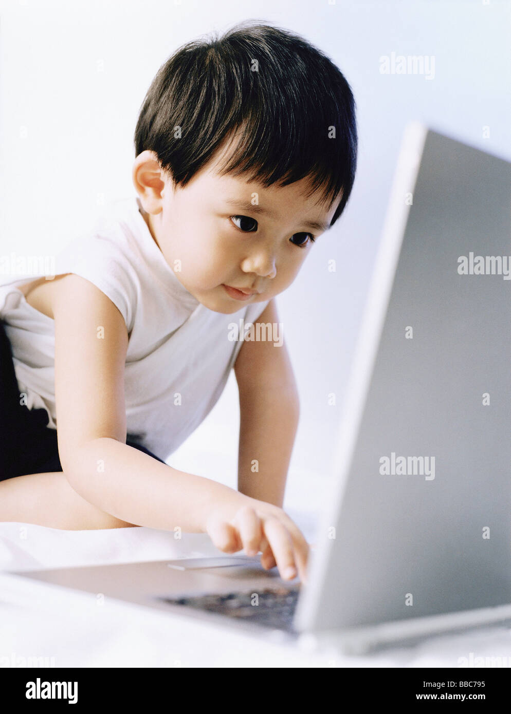 Boy, 3 years old, using laptop Stock Photo - Alamy