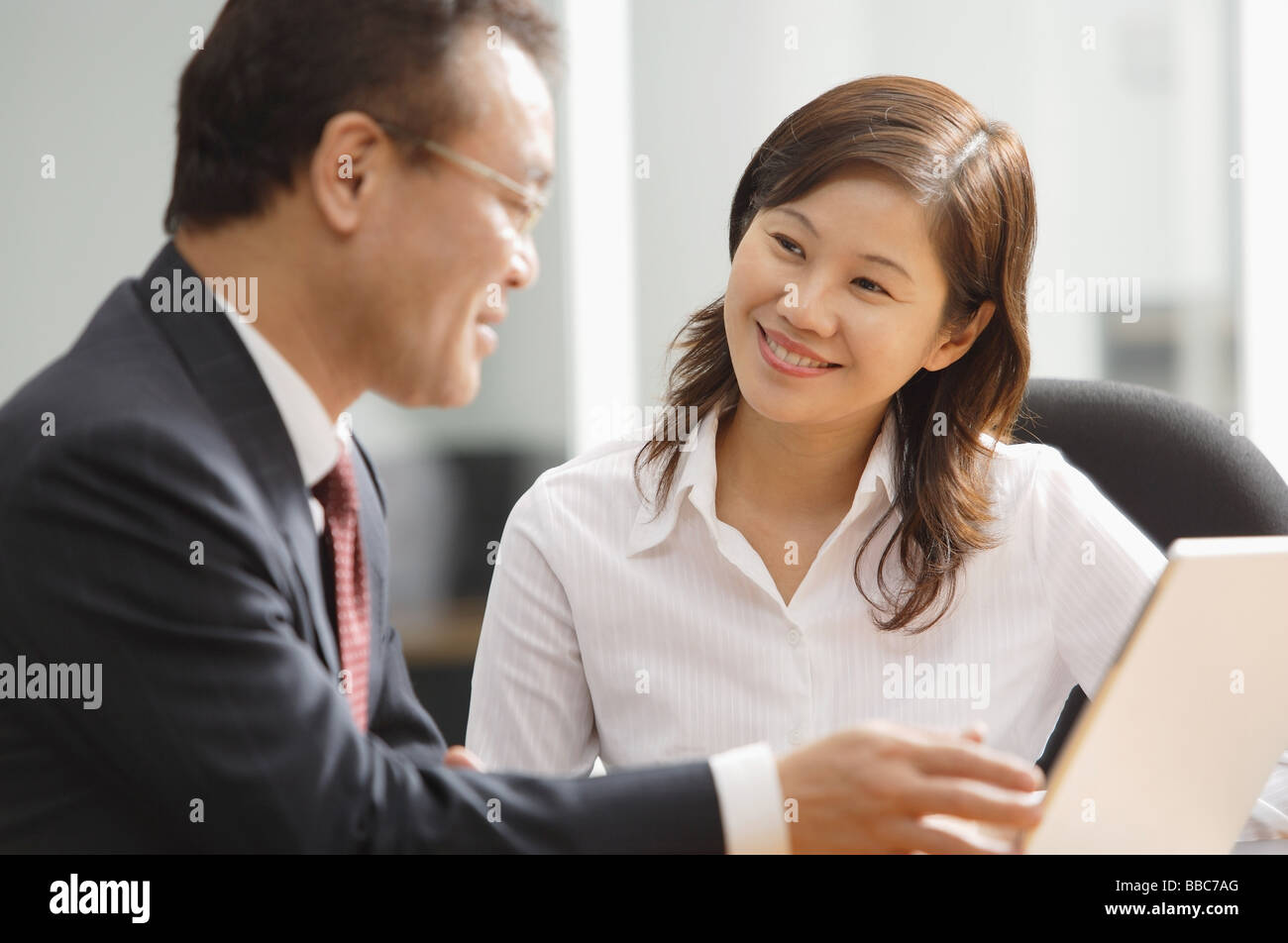 Executives having a discussion Stock Photo - Alamy