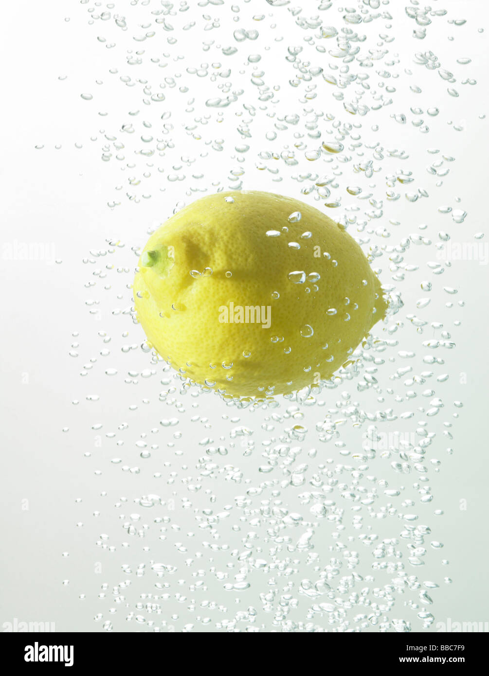 Lemon in water bubbles Stock Photo - Alamy
